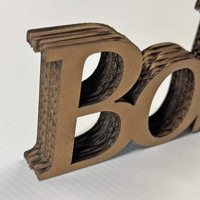 Petit logo signature en carton multi cannelures - LEONARD DIJON